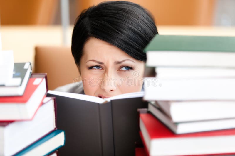 Pretty Female Student Looks Out Over the Book Stock Image - Image of ...