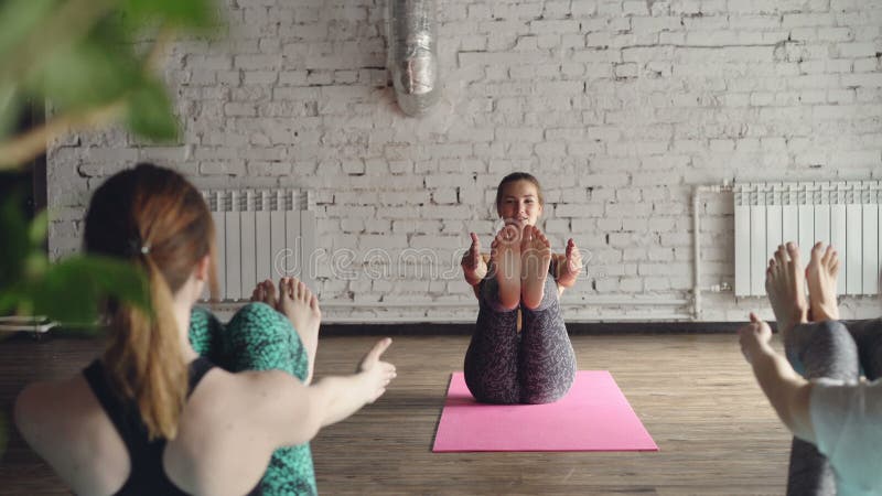 Yoga Instructor is Demonstrating Different Variations of Boat Pose ...