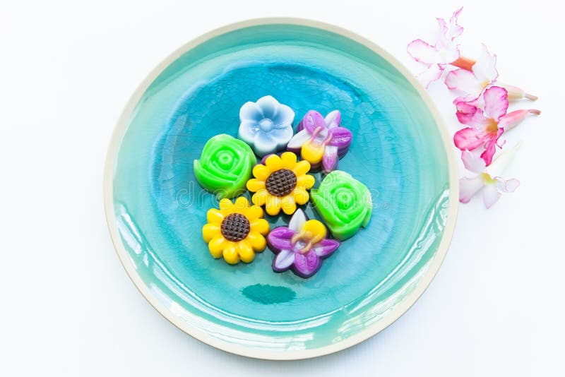 Pretty Flower Shaped Desserts in a Green Plate Stock Photo - Image of ...