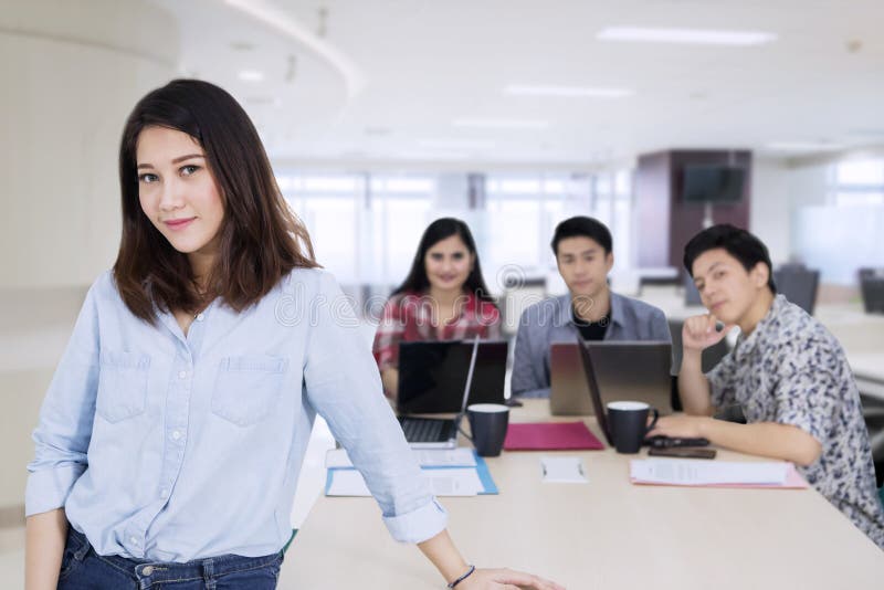 Pretty Freelancer Standing in Front of Her Team Stock Image - Image of ...