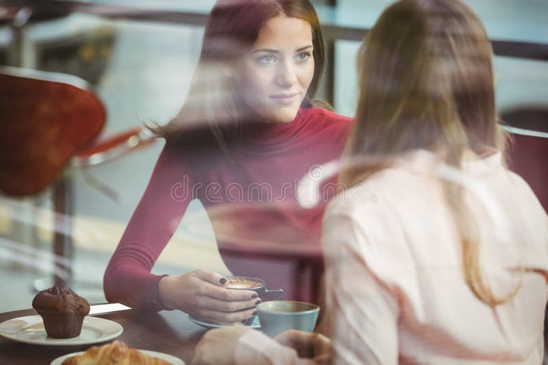 Pretty Friends Chatting Over Coffee Stock Image - Image of holding ...
