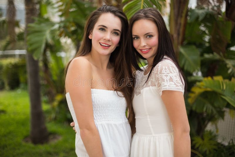 Pretty Friends Smiling at Camera in White Dresses Stock Image - Image ...
