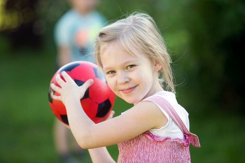 Pretty girl with the ball stock photo. Image of african - 69135638