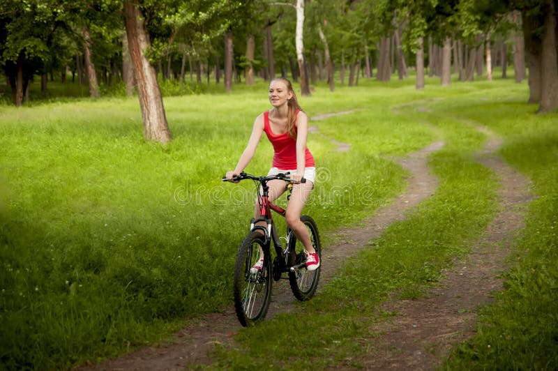 Pretty girl biking stock image. Image of joyful, forest - 37914191