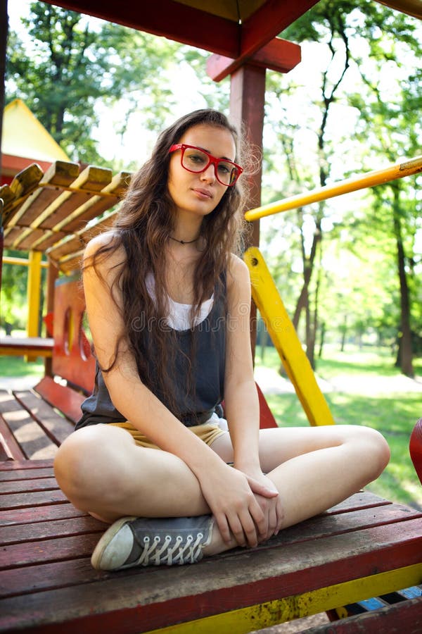 Pretty Girl on Climbing Frame in Park Stock Photo - Image of brunette ...