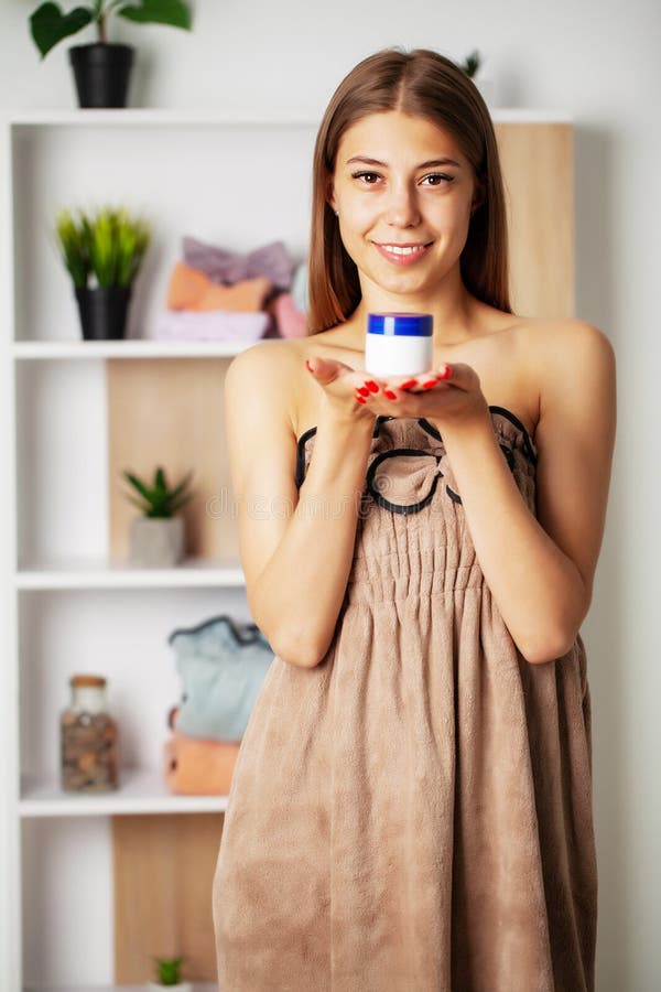 Pretty Girl Doing Facials Care Procedure in the Bathroom Stock Photo ...