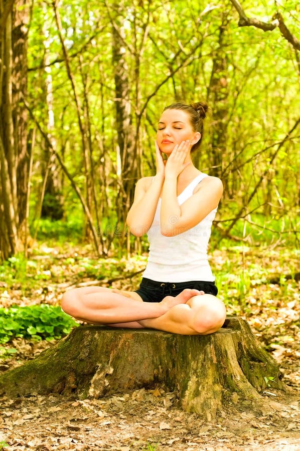Pretty girl doing yoga stock photo. Image of sitting - 14361994