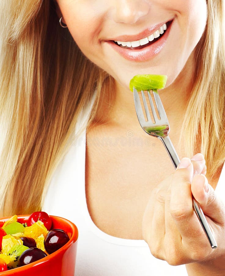 Pretty girl eating fruits stock photo. Image of health - 26537346