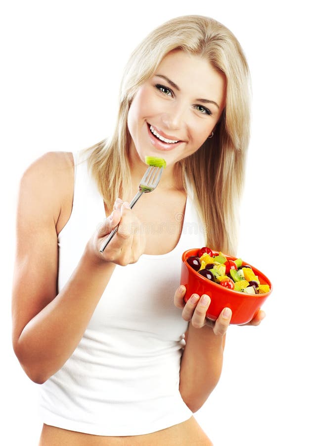 Pretty girl eating fruits stock image. Image of female - 26907525