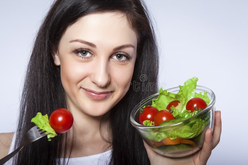 Pretty girl eating salad stock photo. Image of health - 23552244