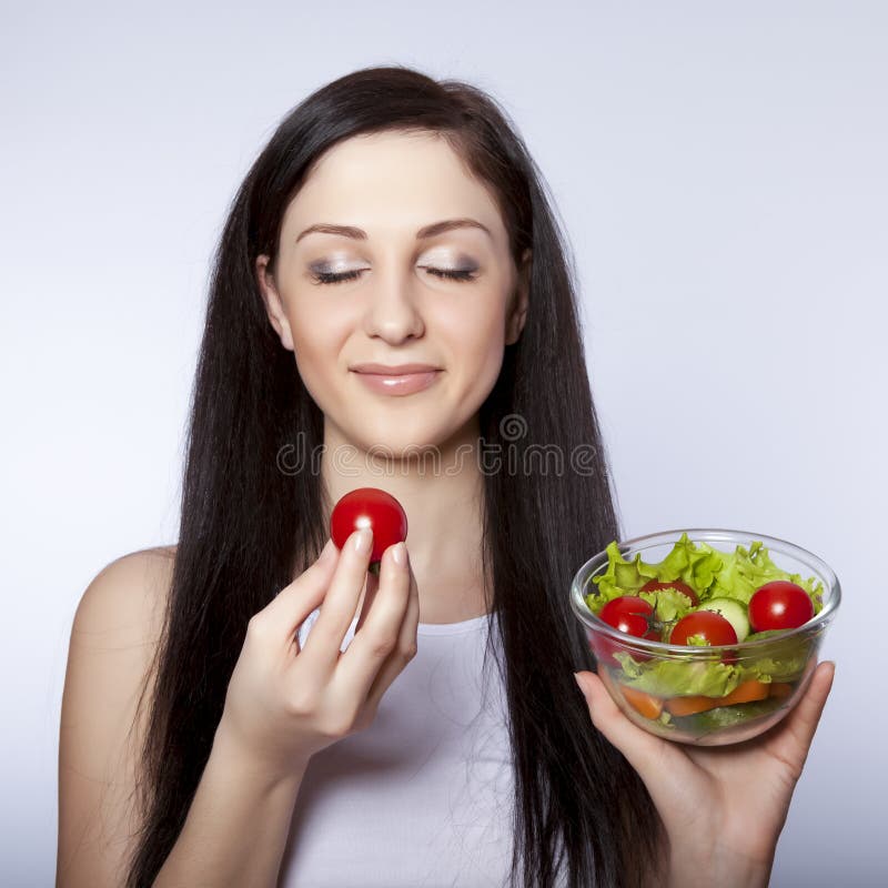 Pretty girl eating salad stock image. Image of happy - 23552333