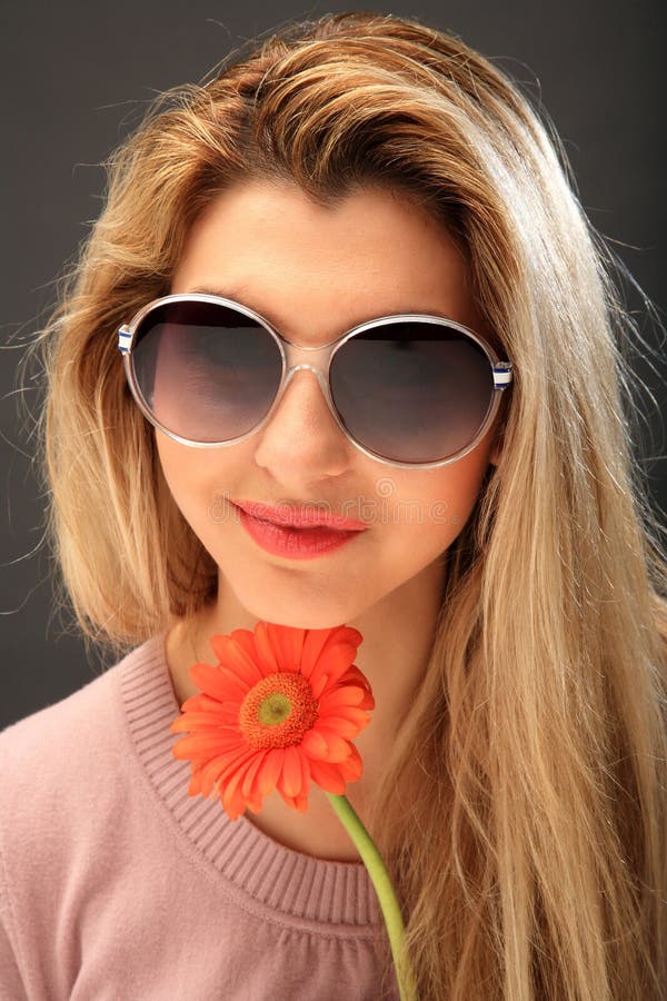 Pretty girl with a flower stock image. Image of fashionable - 26150947