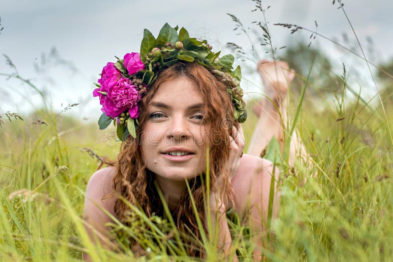 Pretty girl in the grass stock image. Image of field - 98676821