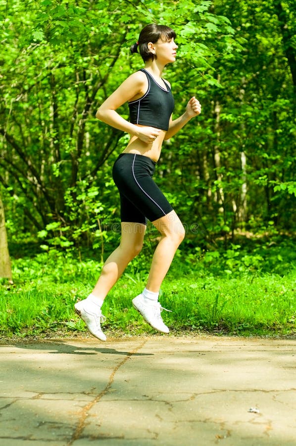 Pretty girl jogging stock image. Image of running, blue - 14285551