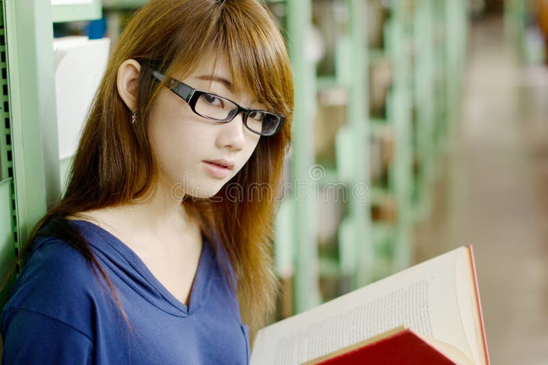 Pretty girl in library stock photo. Image of lady, student - 26222098