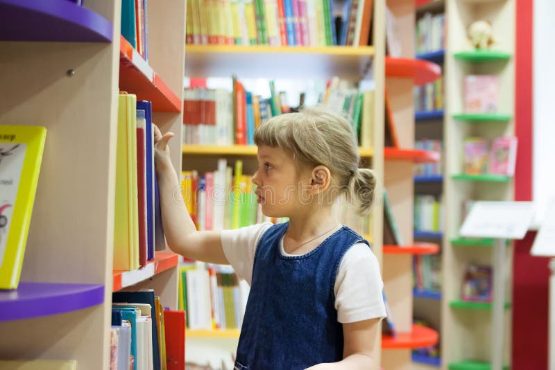 Pretty girl in library stock image. Image of girl, education - 102460621