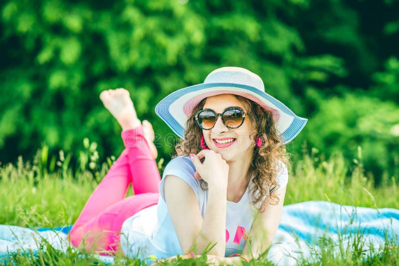 Pretty Girl Outdoor Lying on the Grass in the Park Stock Image - Image ...