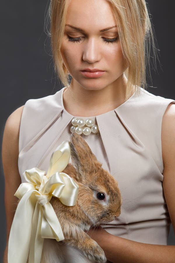 Pretty girl with a rabbit stock photo. Image of beautiful - 24328982