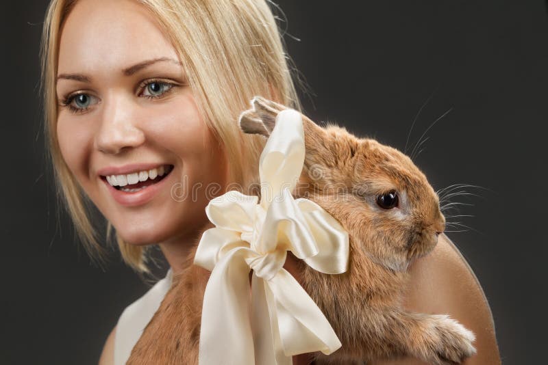 Pretty girl with a rabbit stock photo. Image of lovely - 28329160