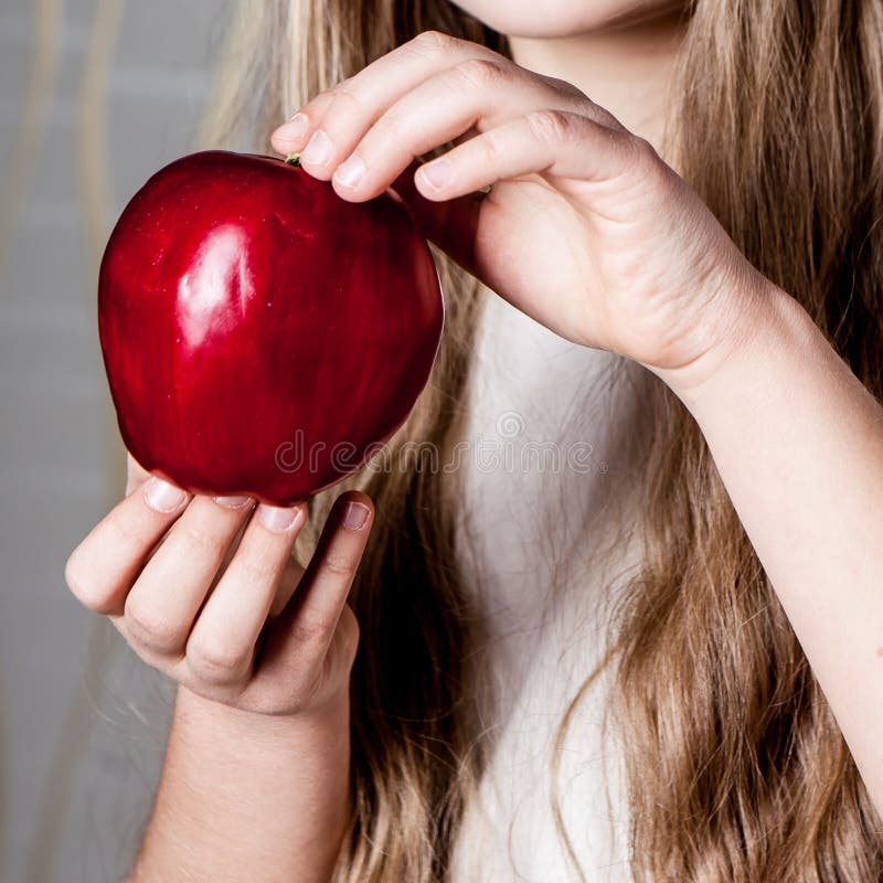 Pretty girl with red apple stock photo. Image of beauty - 53137690