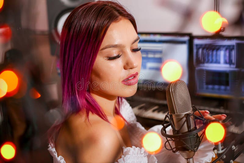 Pretty Girl Singing into Studio Microphone. Stock Image - Image of ...