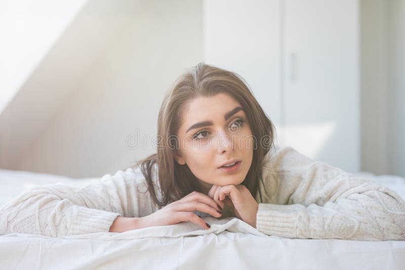 Pretty girl smiling in bed stock photo. Image of awakening - 83139944