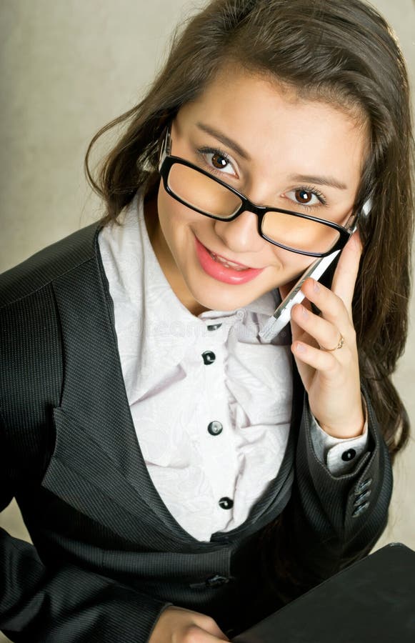 Pretty Girl Talking on the Phone. Stock Photo - Image of employee ...