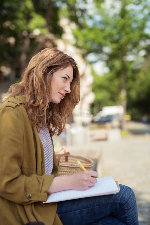 Pretty Girl Thinking What To Write on Her Notes Stock Photo - Image of ...