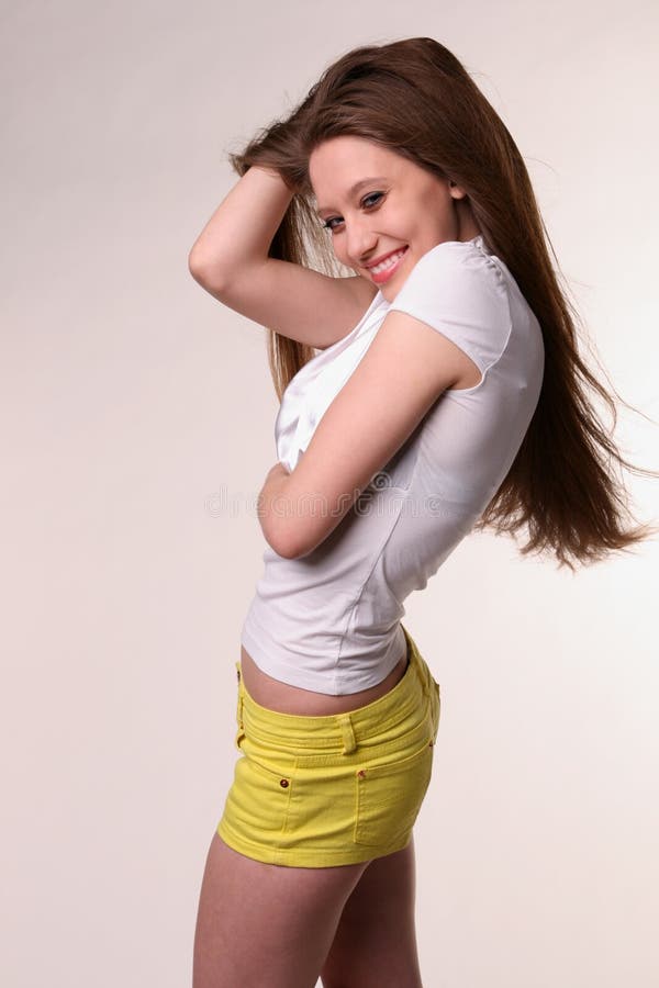 Pretty Girl Turn Sideways and Touch Her Hair. Stock Photo - Image of ...