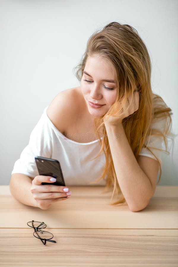 Pretty Girl Using Her Cell Phone in Bedroom Stock Image - Image of city ...