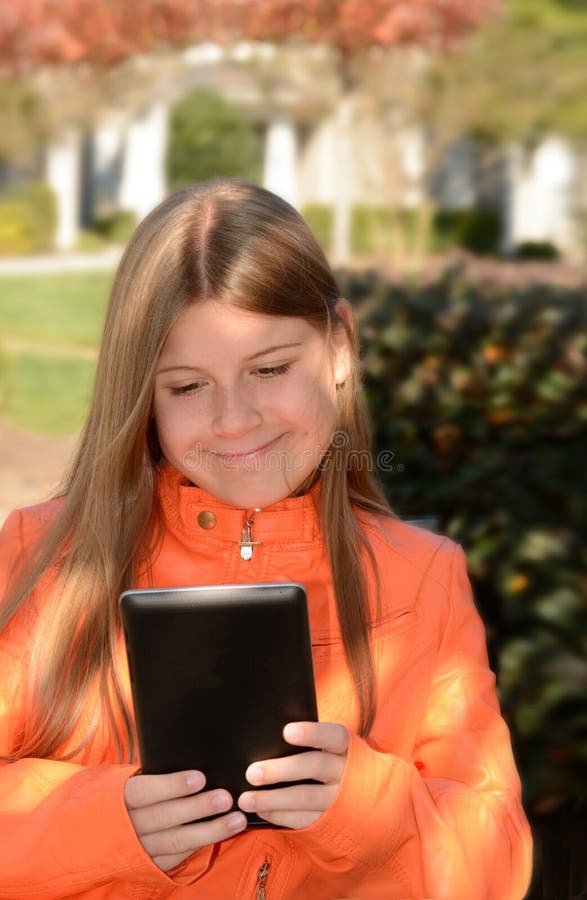 Pretty Girl Using Her Tablet Stock Photo - Image of exploring ...
