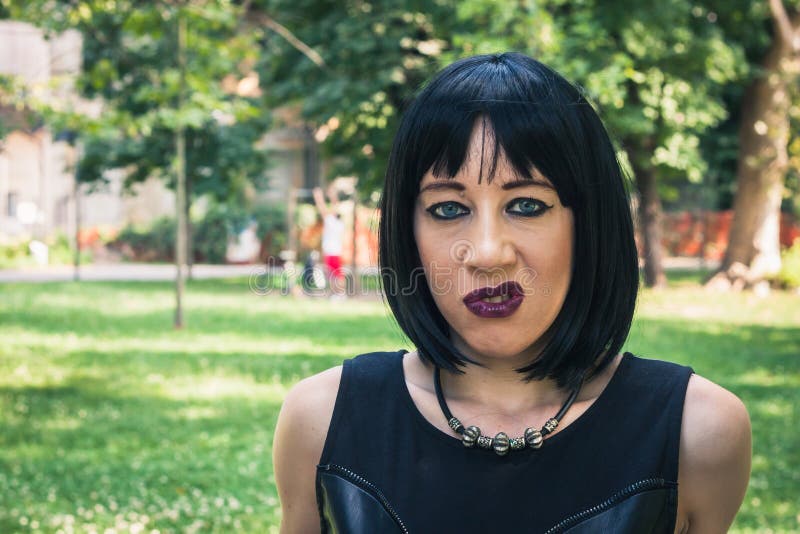Pretty Goth Girl Posing in a City Park Stock Image - Image of grimace ...