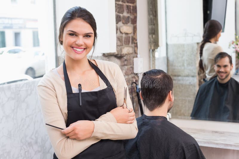 Pretty Hair Stylist Smiling at Camera Stock Photo - Image of salon ...