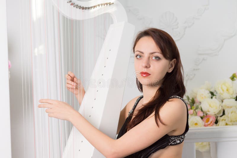 Pretty Harpist Playing Her Harp Stock Photo - Image of copyspace ...
