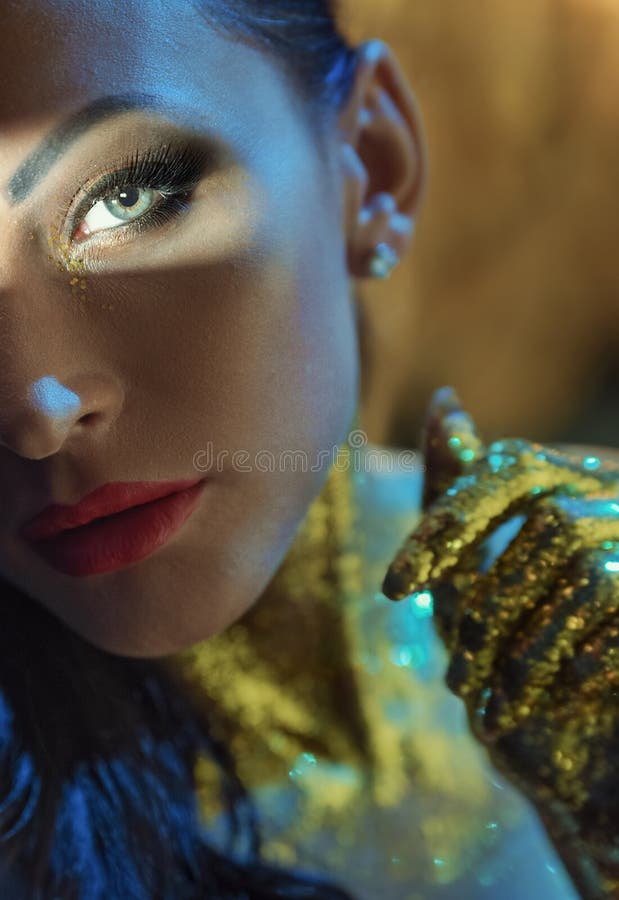 Pretty Lady with Glossy Golden Dust on the Face Stock Photo - Image of ...