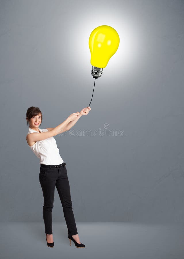 Pretty Lady Holding a Light Bulb Balloon Stock Photo - Image of ...