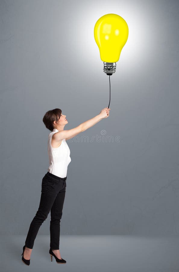 Pretty Lady Holding a Light Bulb Balloon Stock Photo - Image of holding ...
