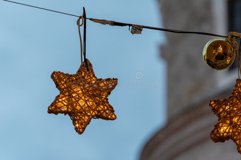 Pretty Light Up Lighted Star Ornament Hanging from a String of Lights ...