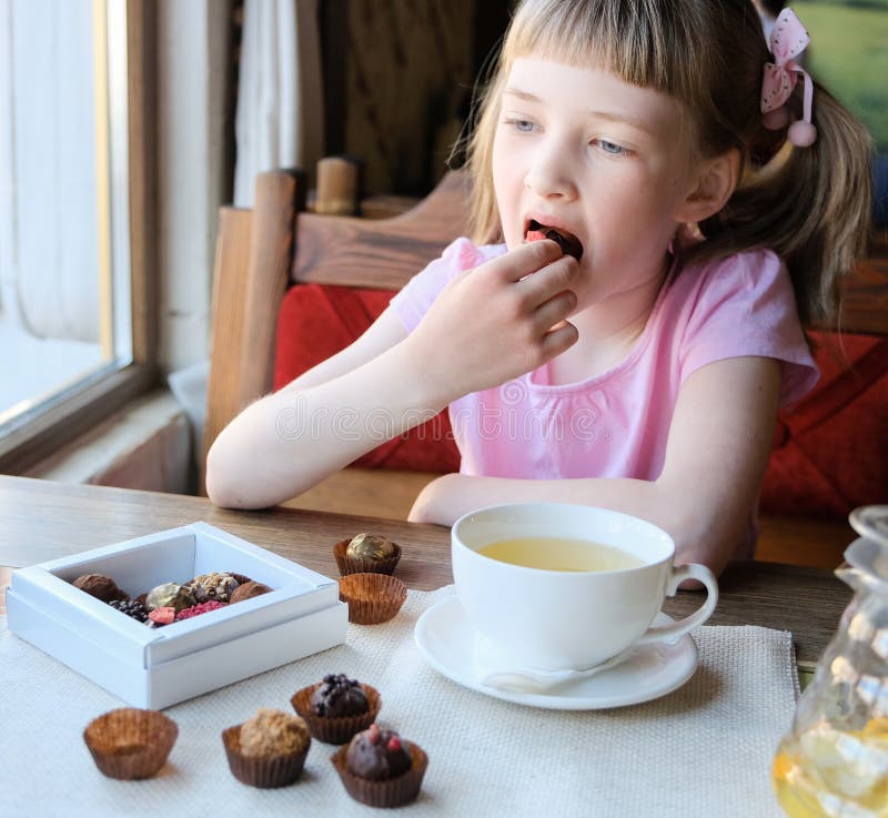 Pretty Girl Eating a Piece of a Pizza and Drinking a Juice Stock Photo ...