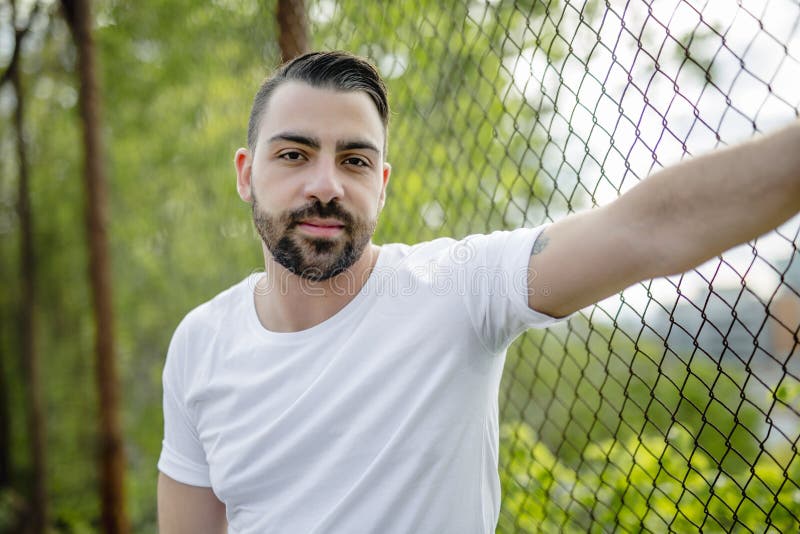 Pretty Men Standing Near Chain Link Fence Stock Photo - Image of rust ...