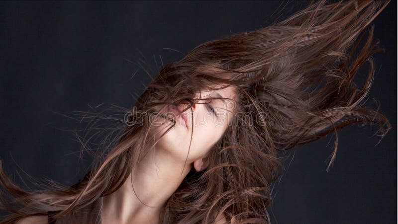 Pretty Model Flinging Hair Wildly Stock Photo - Image of luster, shine ...