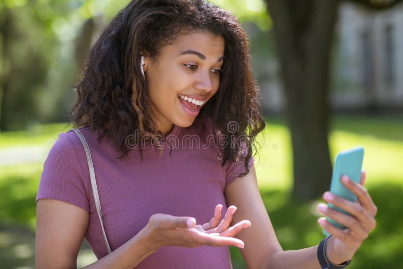 Pretty Mulatta Talking on the Phone and Smiling Stock Photo - Image of ...