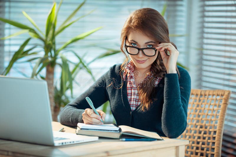 Pretty nerd girl studies stock photo. Image of beauty - 48739766