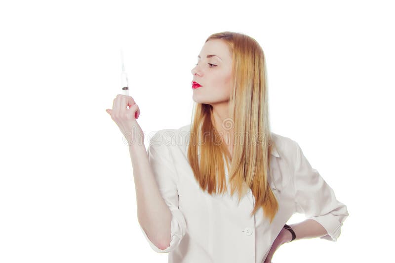 Pretty nurse with syringe stock photo. Image of help - 20668752