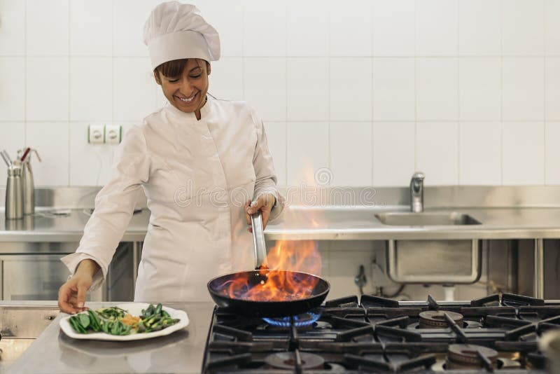 Pretty Professional Chef Cooking. Stock Photo - Image of caucasian ...