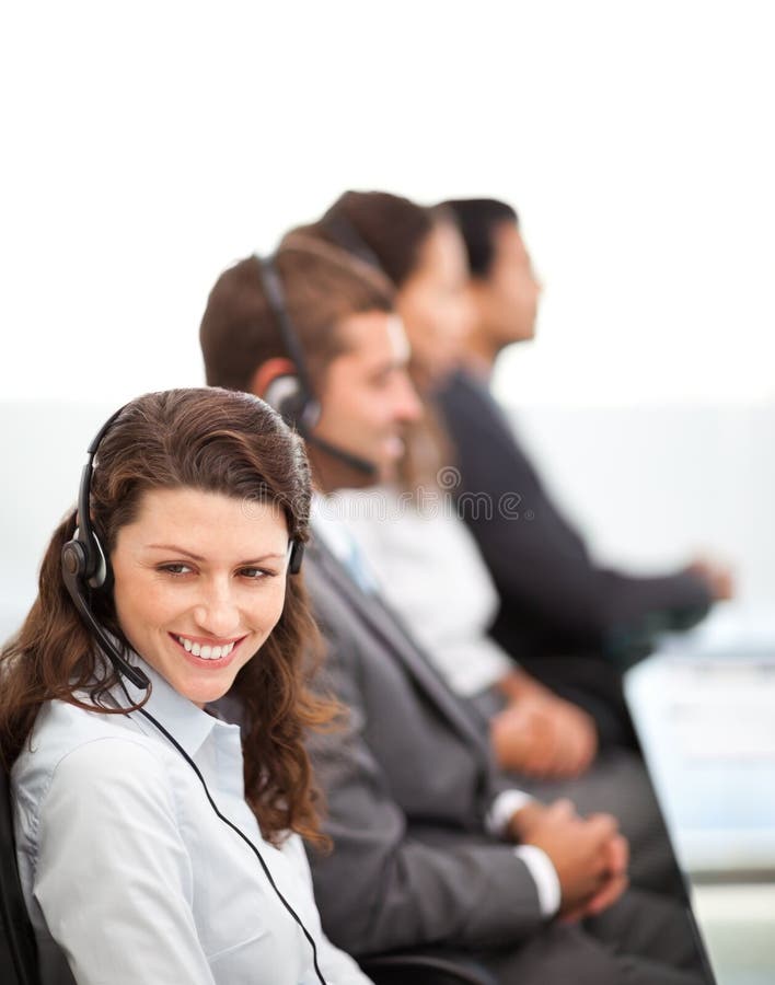 Pretty Representative at Her Desk with Colleagues Stock Photo - Image ...