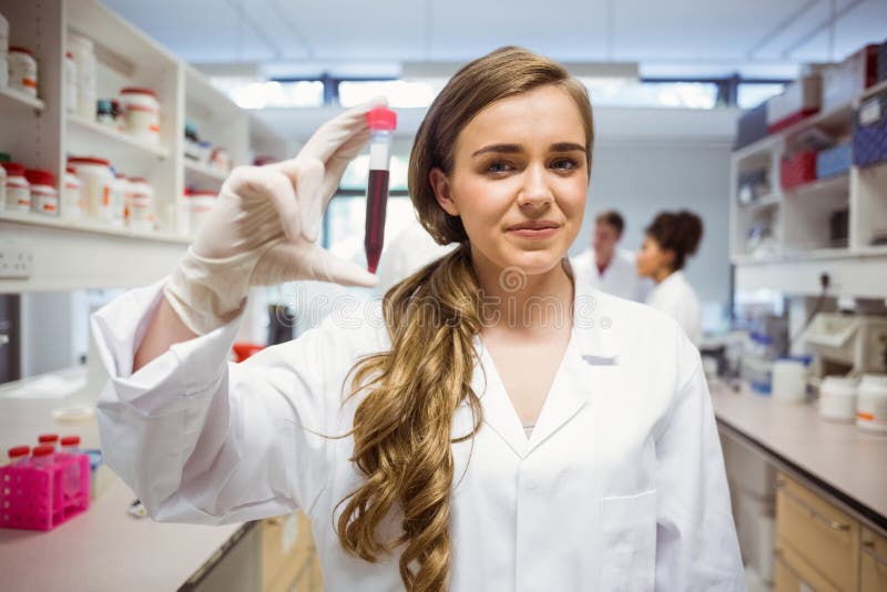 Pretty Science Student Smiling and Showing Vial Stock Photo - Image of ...
