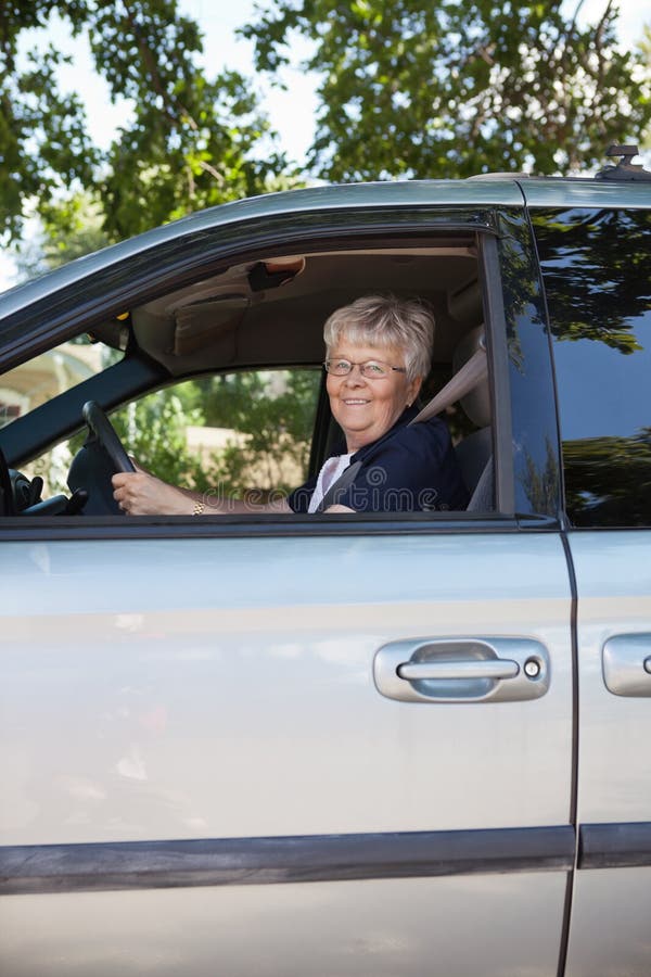 Old woman driving car stock photo. Image of independence - 21774086