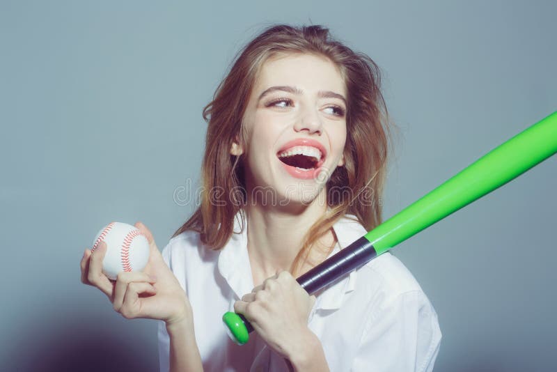 Pretty Woman With Long Hair Holds Green Baseball Bat Stock Image