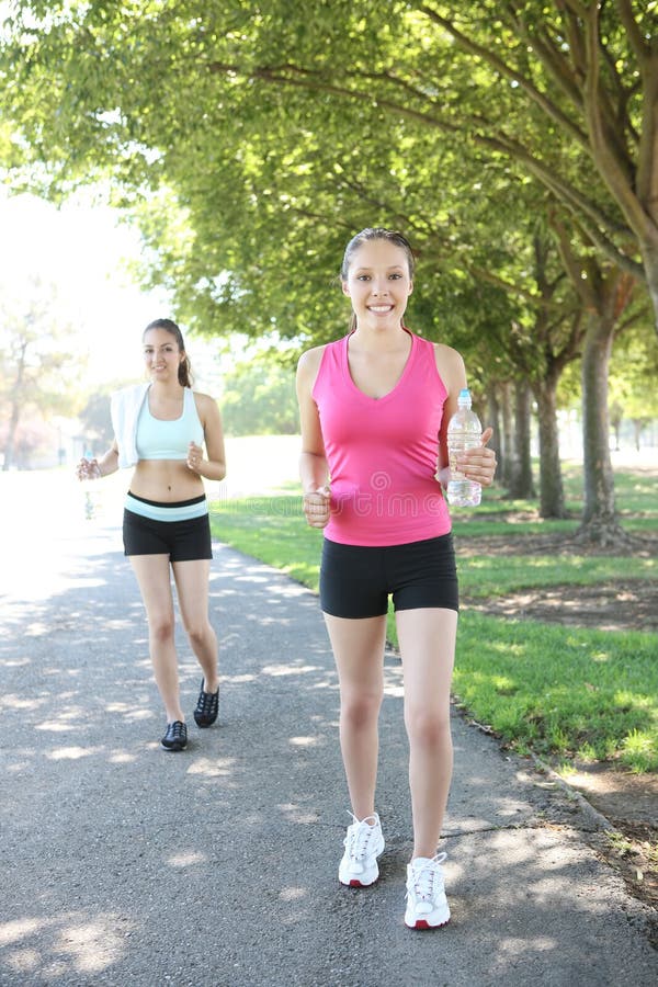 Pretty Sisters Jogging in Park Stock Image - Image of couple, outdoor ...